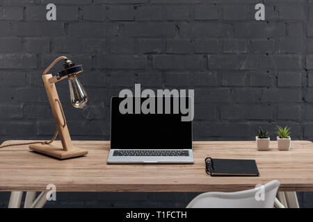 Notebook with green screen near black friday sign on desk Stock Photo ...
