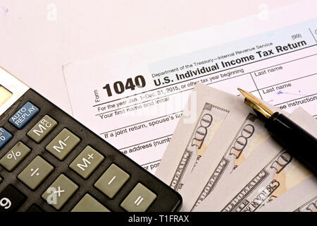 Completing US tax return form 1040 on white background Stock Photo - Alamy