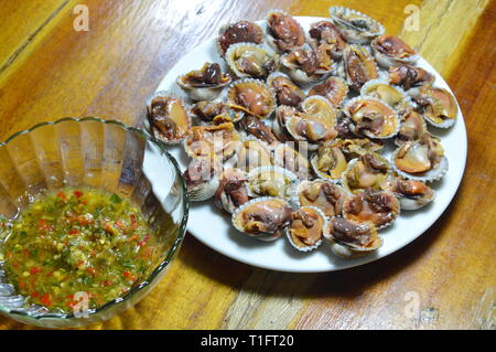 steamed cockle with spicy dipping sauce Stock Photo - Alamy