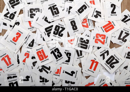 Calendar sheets scattered on the table Stock Photo - Alamy