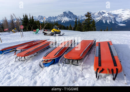 First Aid Safety Ski Patrol Medics attend to a Skier injured in a Ski ...