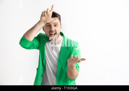 Losers go home. Portrait of happy guy showing loser sign over forehead ...