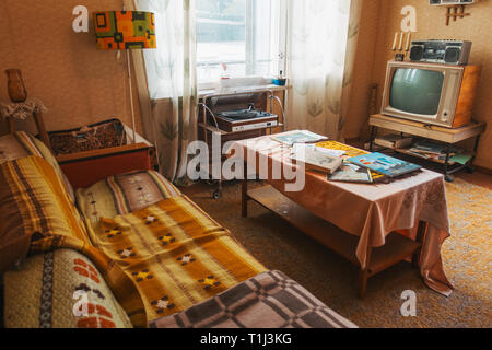 a model 1970s style Soviet era living room, aiming to replicate that of ...