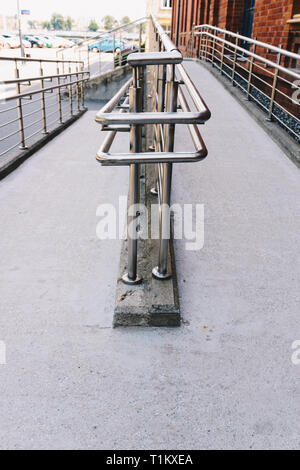 Way of wheelchair, concrete ramp way with stainless steel handrail with ...