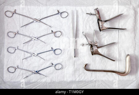 Gynecological sterile tools. A lot of instruments of gynecologist on ...
