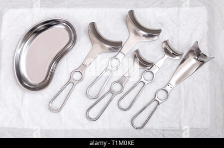 Gynecological sterile tools. A lot of instruments of gynecologist on ...