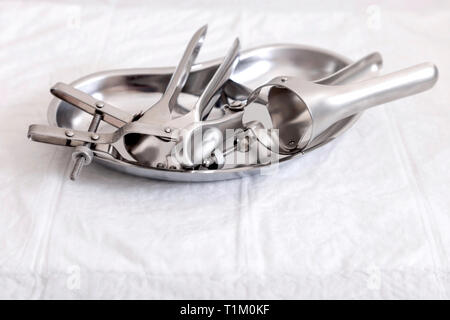 Gynecological sterile tools. A lot of instruments of gynecologist on ...