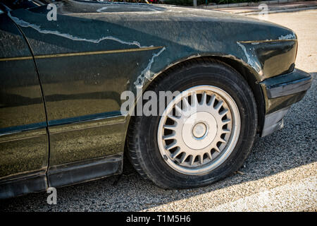 Wasted care with punctured tyres and and open fuel tank Stock Photo - Alamy