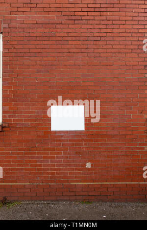 Abstract photograph of a Blank white rectangular sign panel fastened to ...