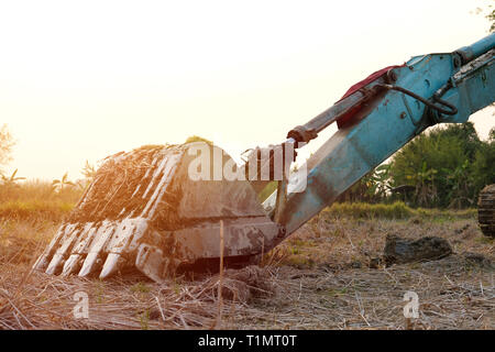 excavator backhoe digger tractor at construction site Stock Photo - Alamy