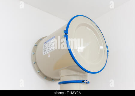 Collective CBRN filtration system attached to a valve in the wall of a ...