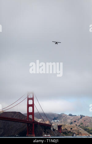 Float plane flies above Golden Gate bridge Stock Photo - Alamy