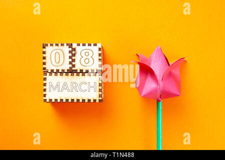 wooden cubes with the inscription March 8 on orange background. 8 march ...
