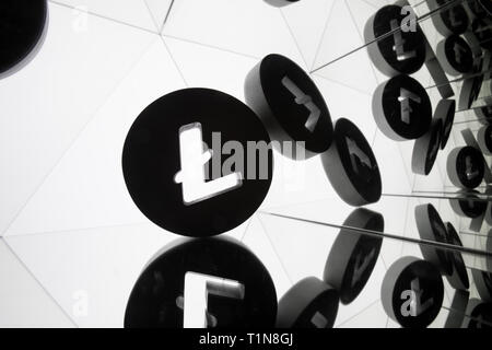 Litecoin Currency Symbol With Many Mirroring Images of Itself on Blue ...