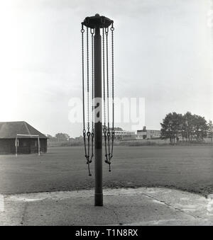 Empty swing on chains on children playground in city Stock Photo - Alamy