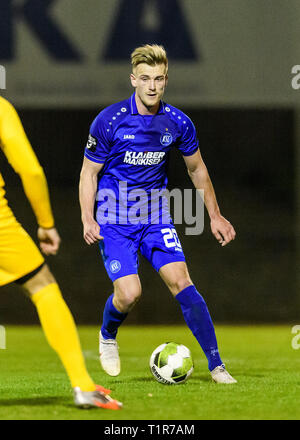 Mannheim, Deutschland. 27th Mar, 2019. Christoph Kobald (KSC) duels ...