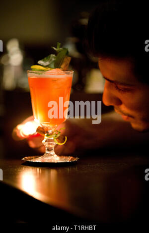 Fire ice cocktail with mint and cinnamon Stock Photo - Alamy
