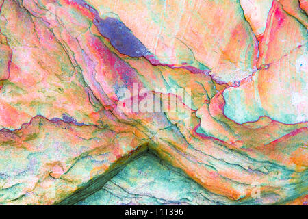 Green, orange, yellow sediments and minerals, rock formations - a ...