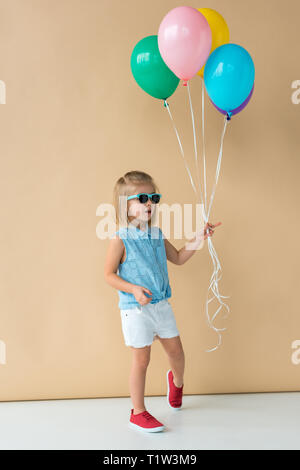 Fashionable pink sunglasses on beige background. Concept of summer ...