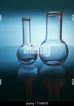 two beacons in the backlight, reflection, blue background Stock Photo ...