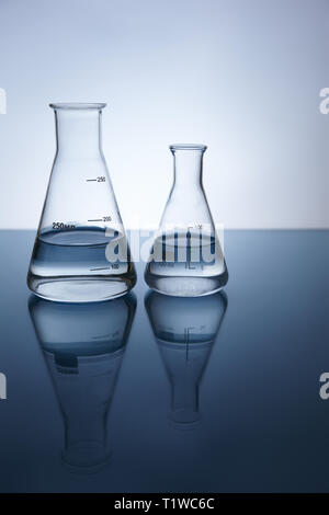 two beacons in the backlight, reflection, blue background Stock Photo ...