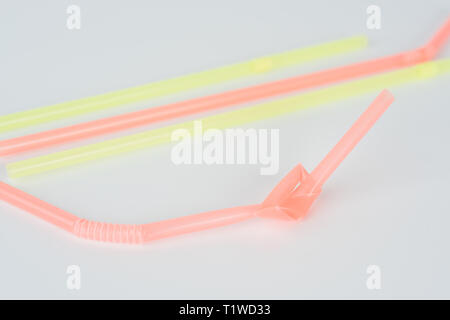 Disposable plastic knotted drinking straw. Conceptual photo about ...