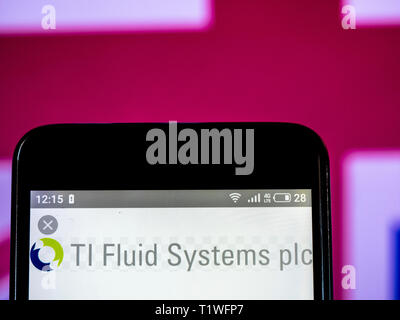 In this photo illustration a TI Fluid Systems logo seen displayed on a ...