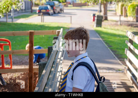 Young Boy Looking Over A Bridge With His Pants Falling Down And The ...