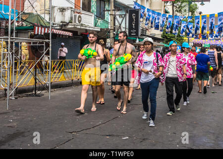 People with water guns celebrating the Thai new year of Songkran in ...
