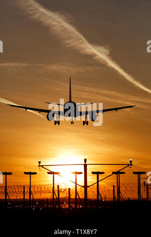 Airliner landing at Heathrow airport at sunset Stock Photo - Alamy