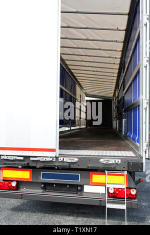 Rear view of semi truck with open back Stock Photo - Alamy