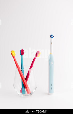 Manual regular Toothbrush Against Modern Electric Toothbrush. Isolated ...