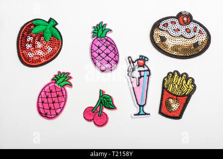 Cocktail fabric patch on white Stock Photo - Alamy