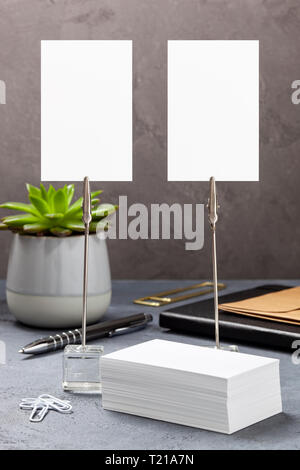 Blank business cards, clips and pen on color background Stock Photo - Alamy