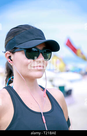 Middle age hispanic sporty woman having online fitness class at sport ...