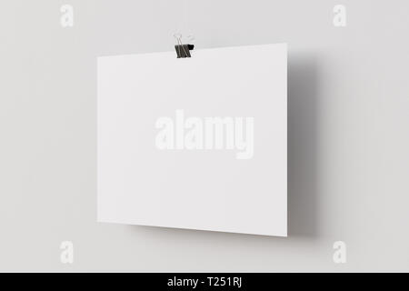 Blank horizontal paper poster hanging on binder clip on wooden wall ...