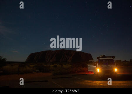Uluru at night with car in front, ayers Rock, the Red Center of ...