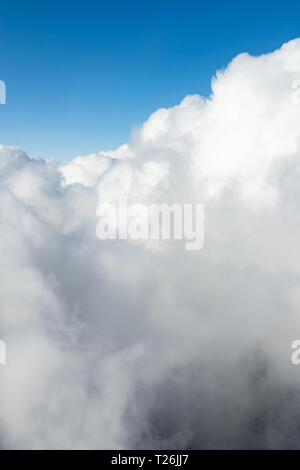 Impressive cloudscape with white clouds beneath blue sky Stock Photo ...