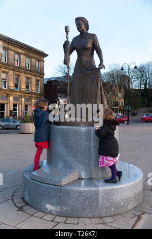 Two children / kids / girls admire the statue of Dame Gracie Fields ...