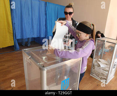 Ukrainians are seen voting at a polling station during the Ukrainian ...