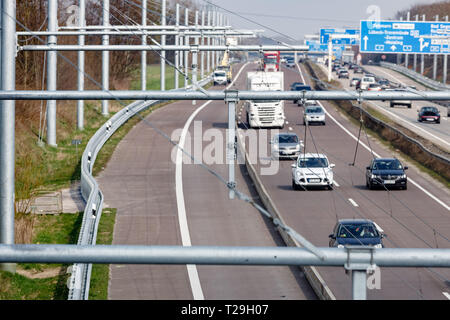 Reinfeld, Germany. 30th Mar, 2019. Cars and trucks drive past newly ...