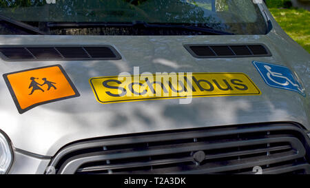 Handicap sticker on school bus in the lot waiting to be dispatched to ...