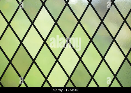 The diamond shaped pattern of a stained glass window UK Stock Photo - Alamy