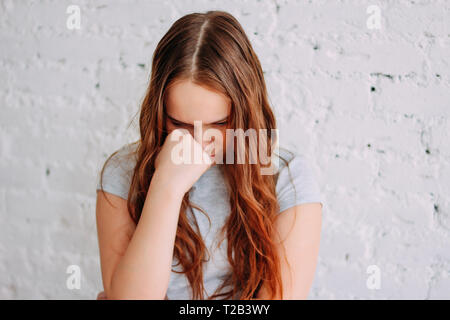 Crying child with curly red hair Stock Photo - Alamy