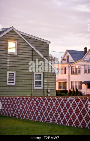 Lights shining through the window of a house at night Stock Photo - Alamy