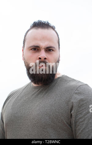 Angry bearded man staring Stock Photo - Alamy