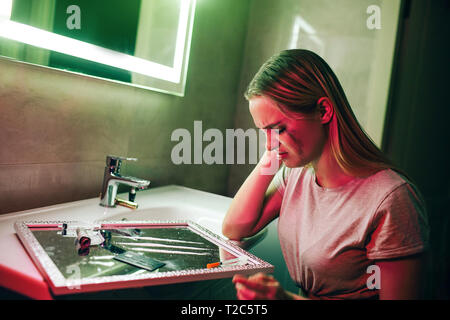 Drugs kill you. Say no to drug. Drug addict cries on drugs background ...