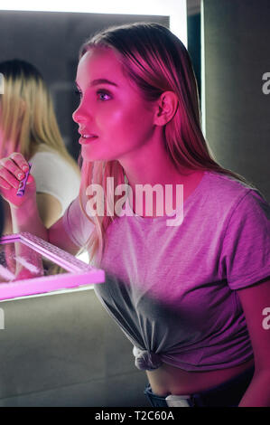 Drugs destroy your life. Young drug addict takes cocaine with rolled ...