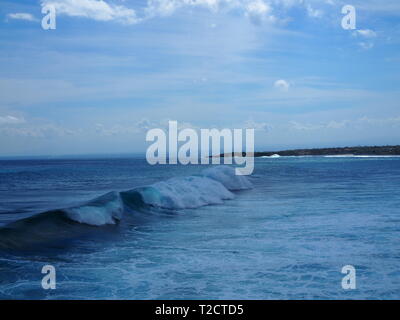 Surfing at Mahana Point, Ceningan Island, Nusa Penida, Indonesia Stock ...