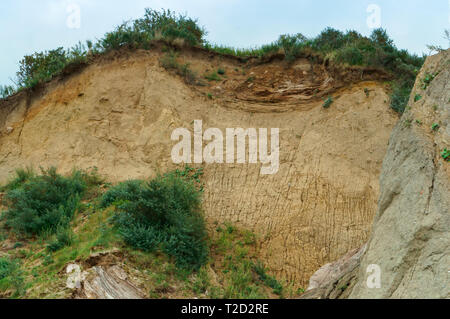 Steep cliff, seashore landscape. Cliff of clay and sea beach. Beautiful ...